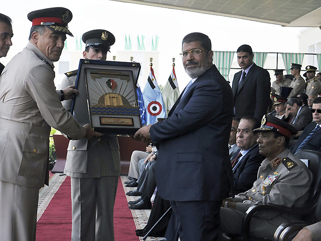 Egypt: In court, defiant Mursi says he is still president | GMA News Online